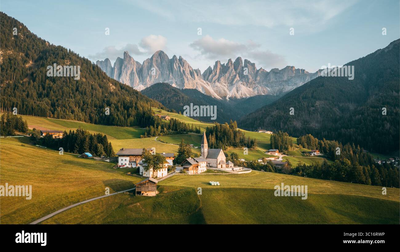 Aerial view of Santa Maddalena village nestled in the valley, with the ...