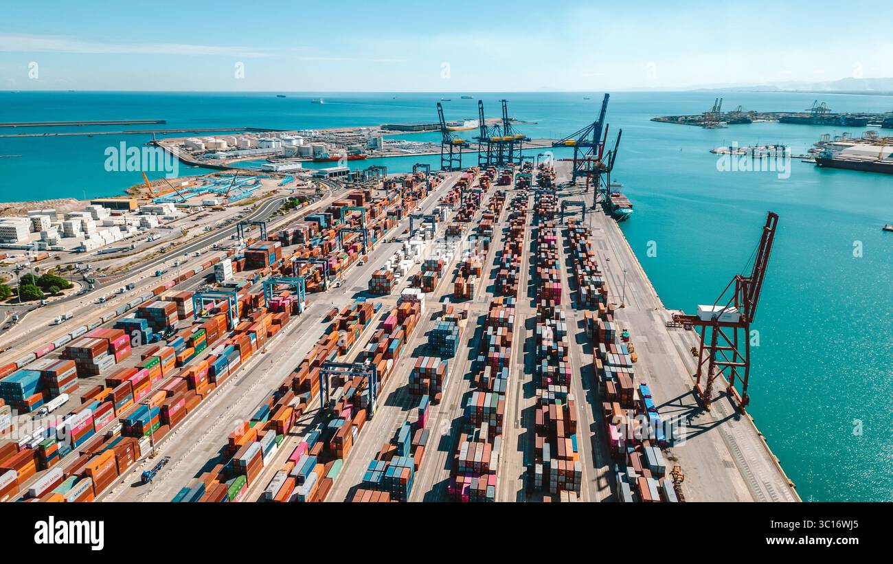 Aerial view of a sprawling port with stacks of multicolored containers ...