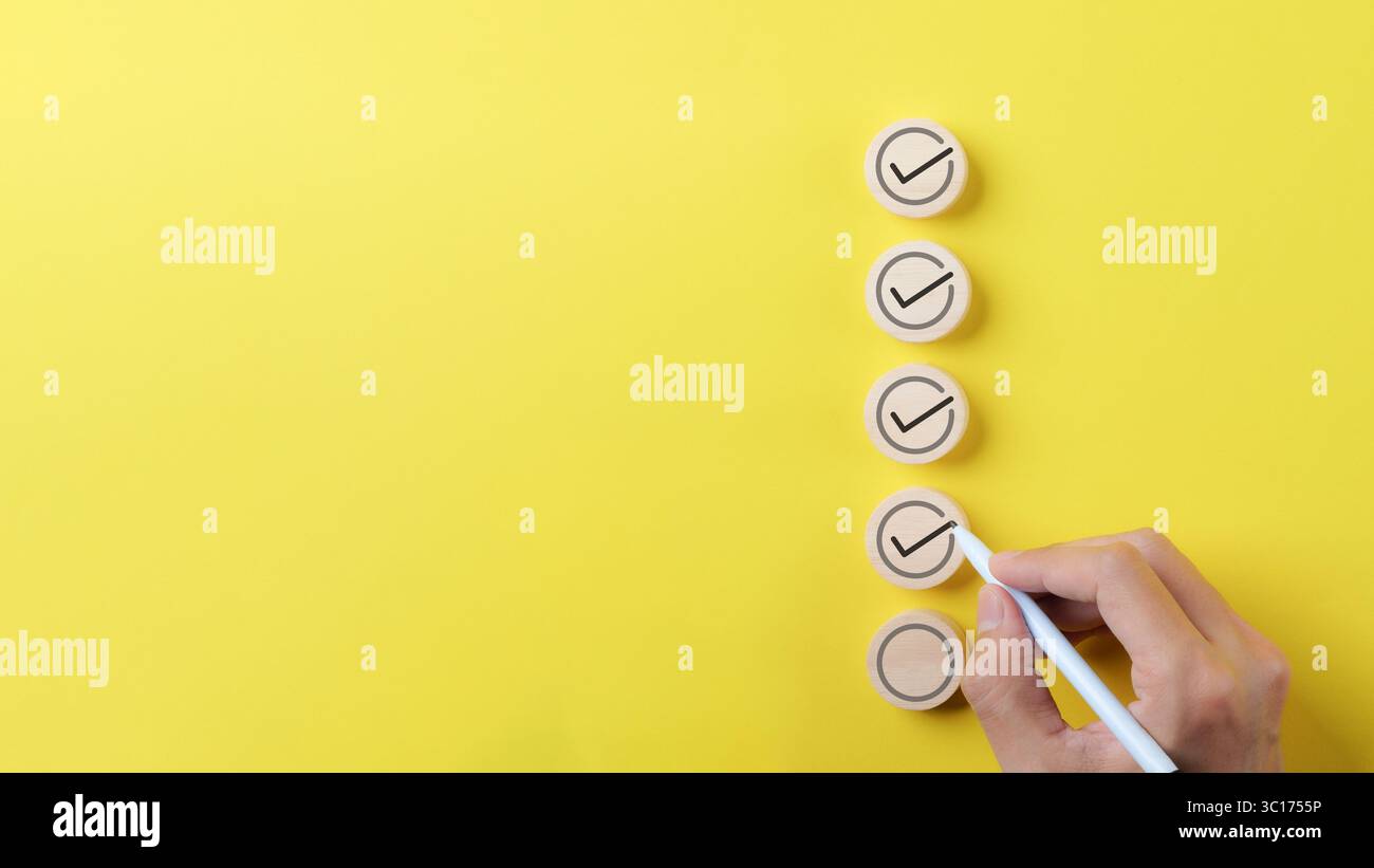 Checklist concept. Person using a black ink pen to correct sign and ...