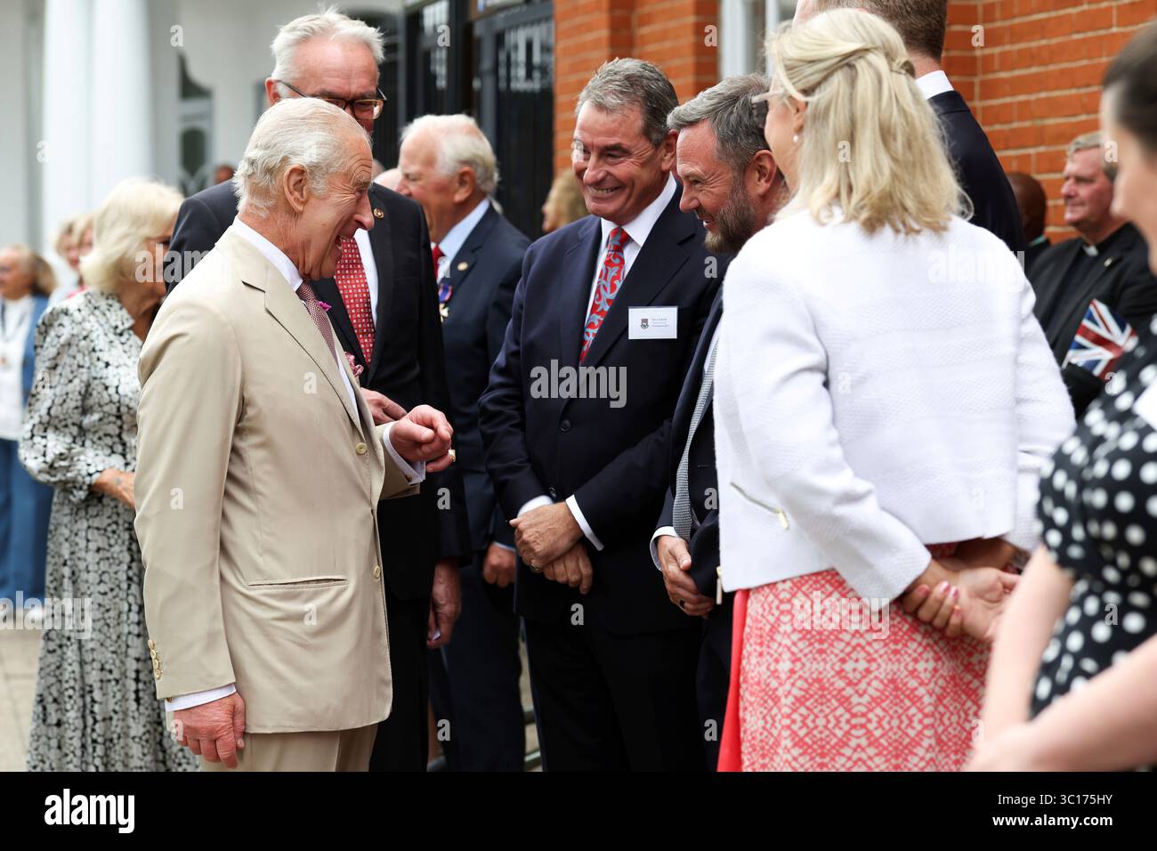 Britain's King Charles III, left, meets with Chairman of Ipswich Town ...