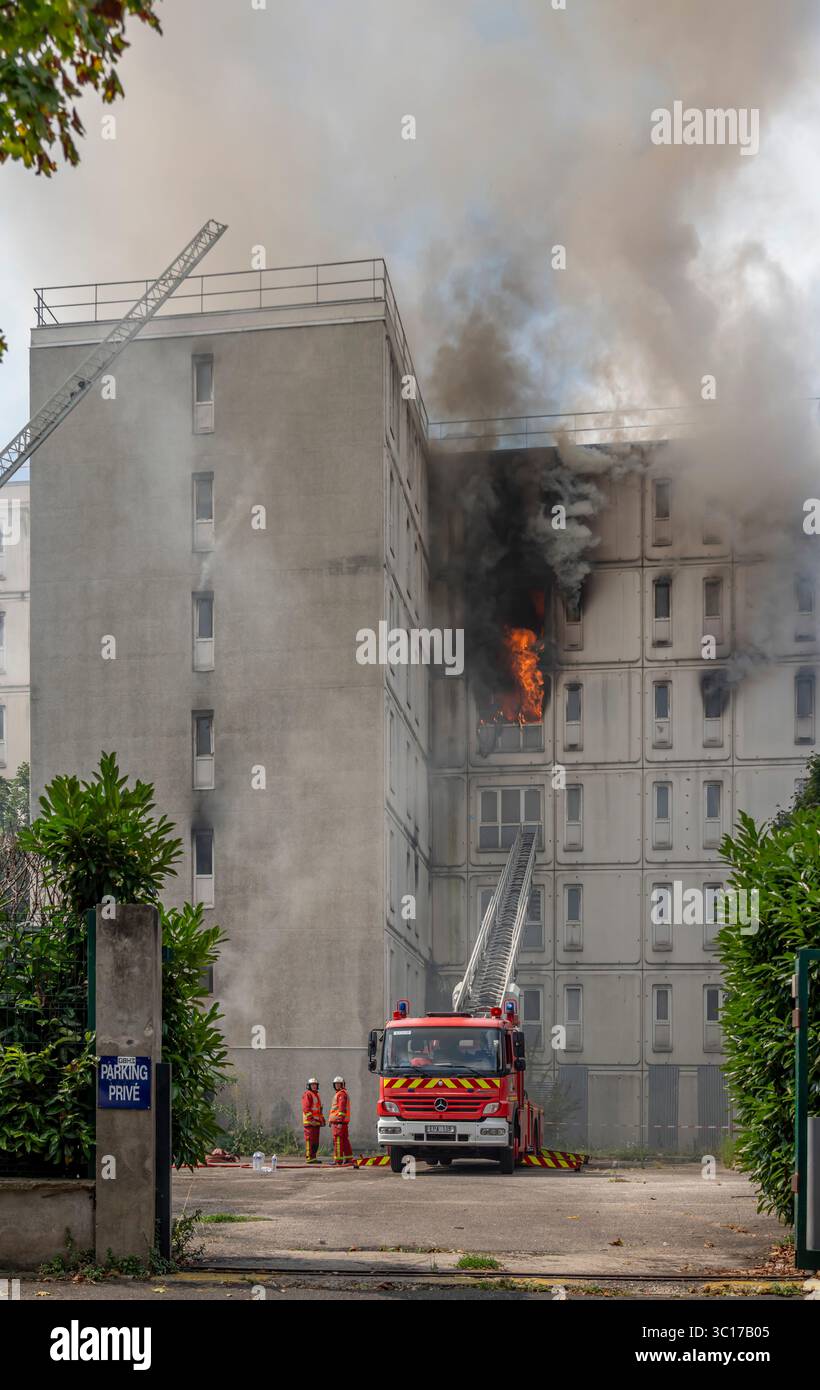 Gennevilliers, France - 07 14 2025: A group of Firefighters and a red ...