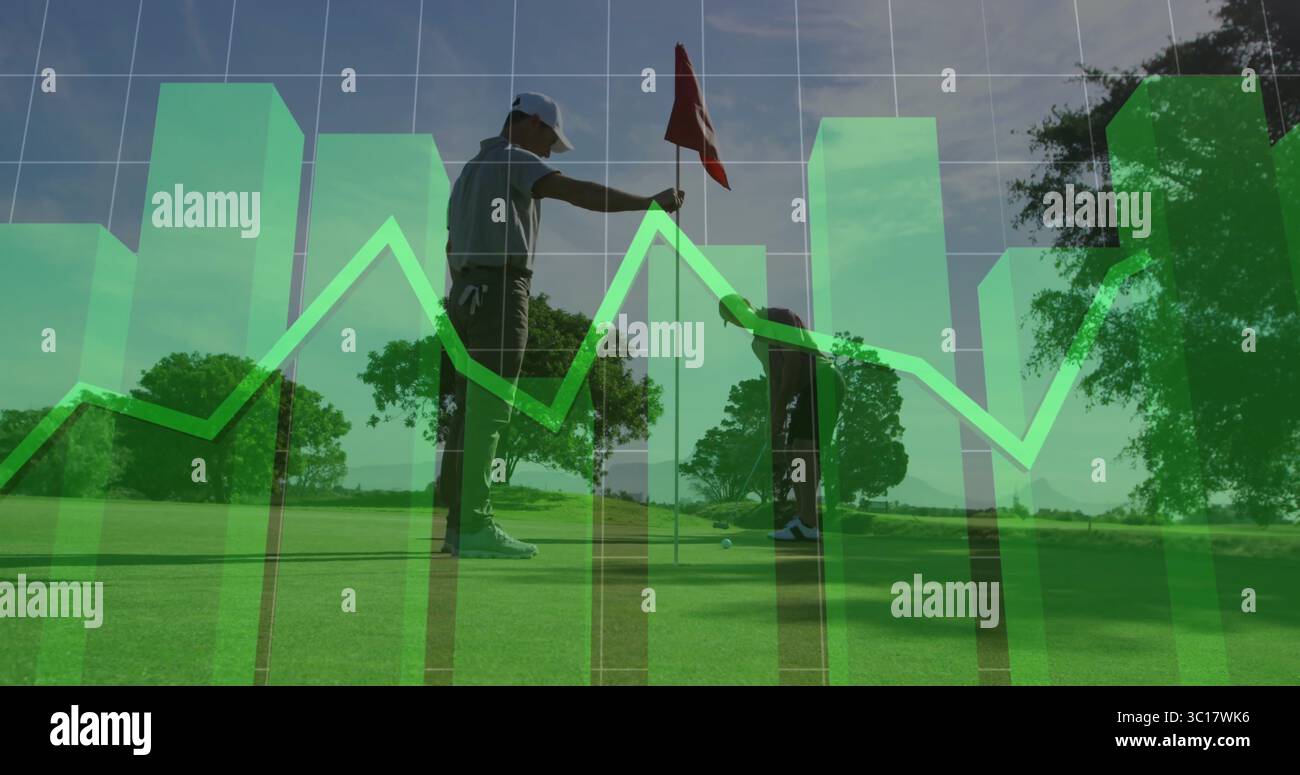 Two golfers adjusting golf ball in hole on putting green, with red ...