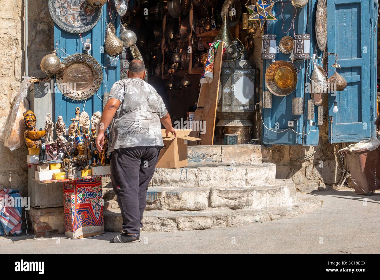 Old Cairo Street Scene with shop front selling various colourful items ...