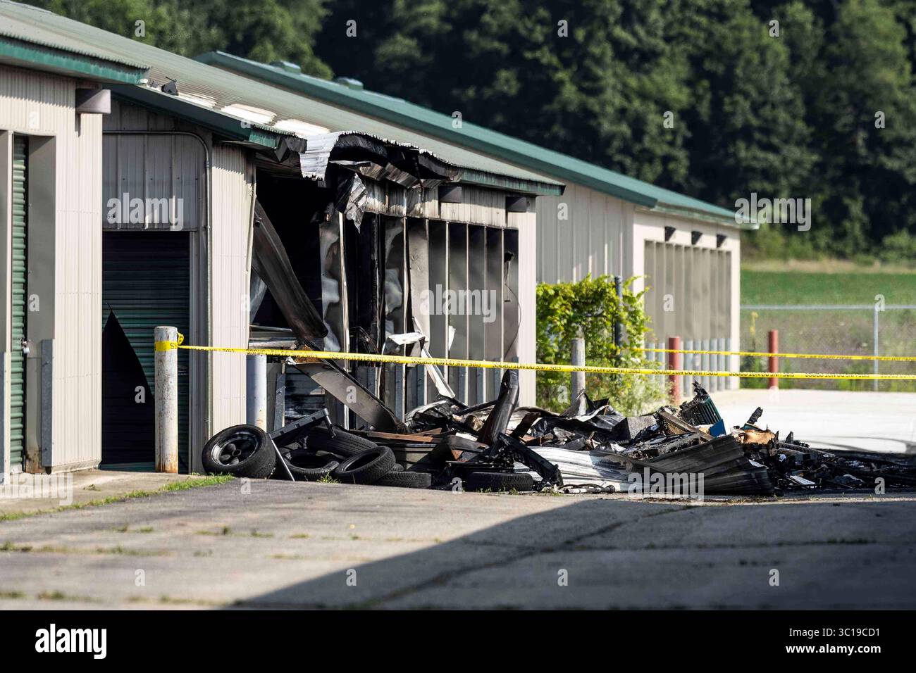 Wreckage from a deadly plane crash lies at Priceless Storage in Lowell ...