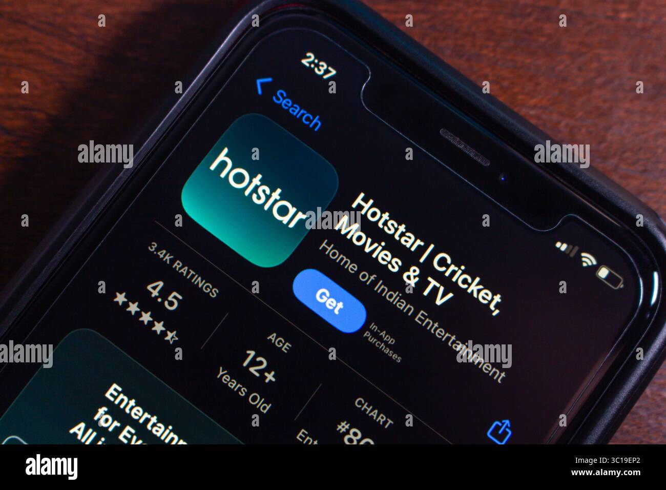 Close-up of a smartphone showing the Hotstar app download page on the ...