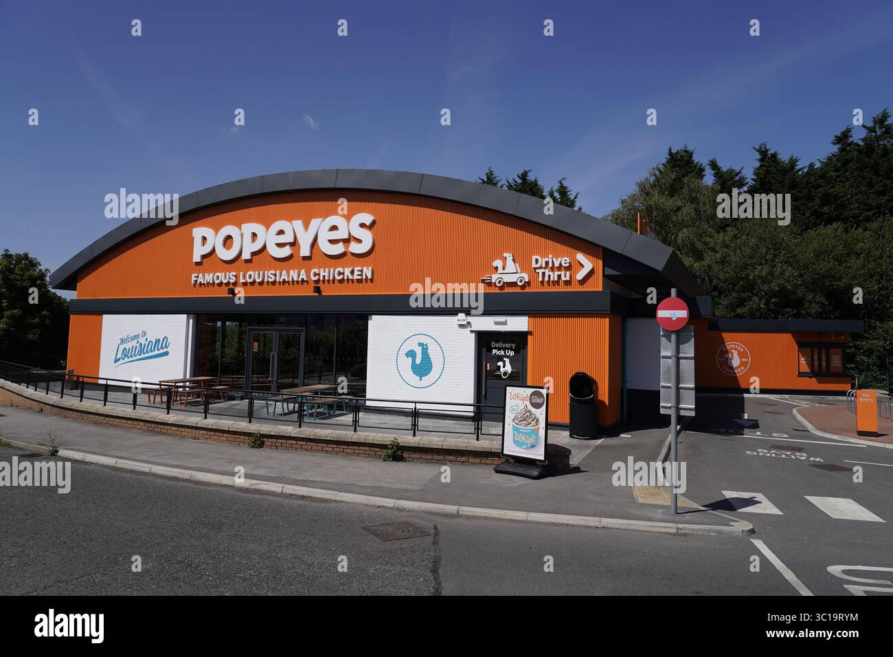 Popeyes fast-food chicken drive through from Louisiana. Corporate logo ...
