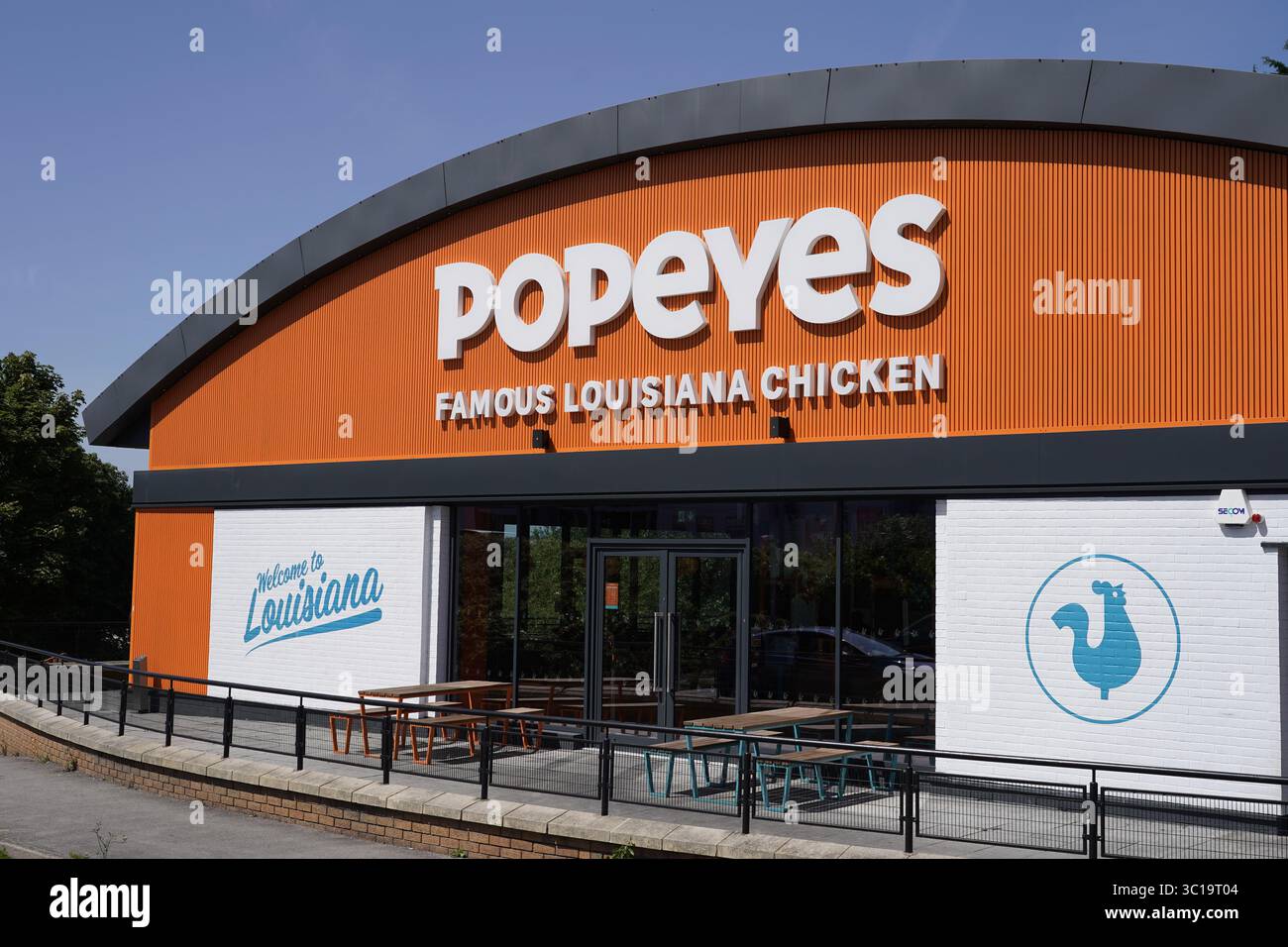 Popeyes fast-food chicken drive through from Louisiana. Corporate logo ...