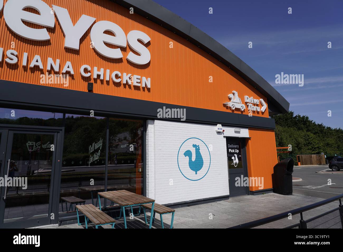 Popeyes fast-food chicken drive through from Louisiana. Corporate logo ...