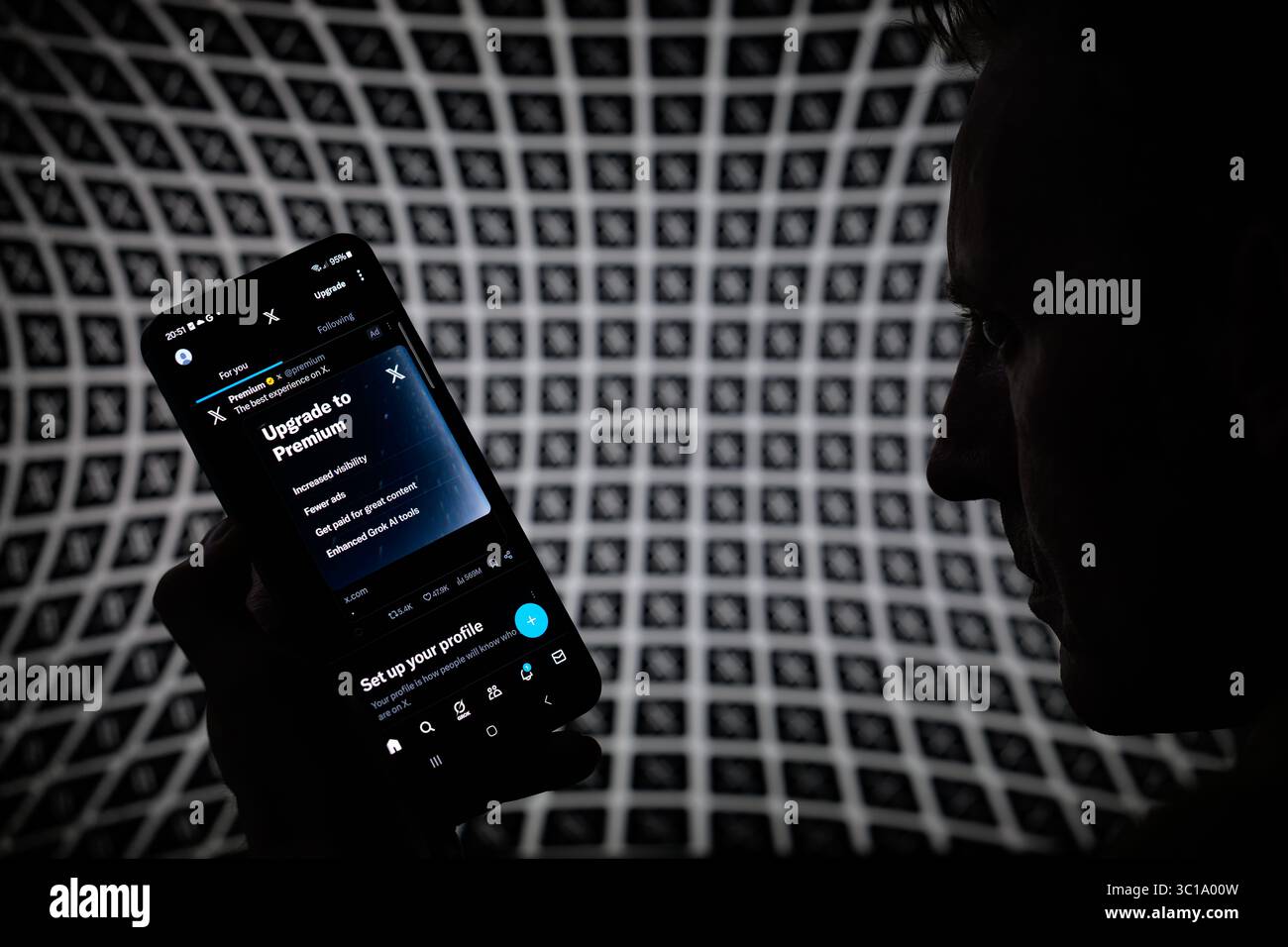 Social media X profile is being displayed on a mobile phone with X icon ...