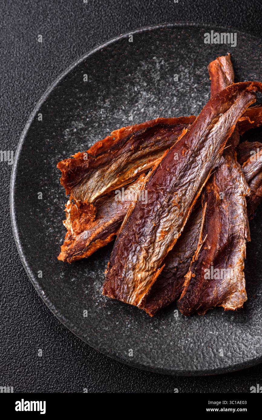 Dried salted fish as snacks or jerky, seafood as slices. Dried seafood ...
