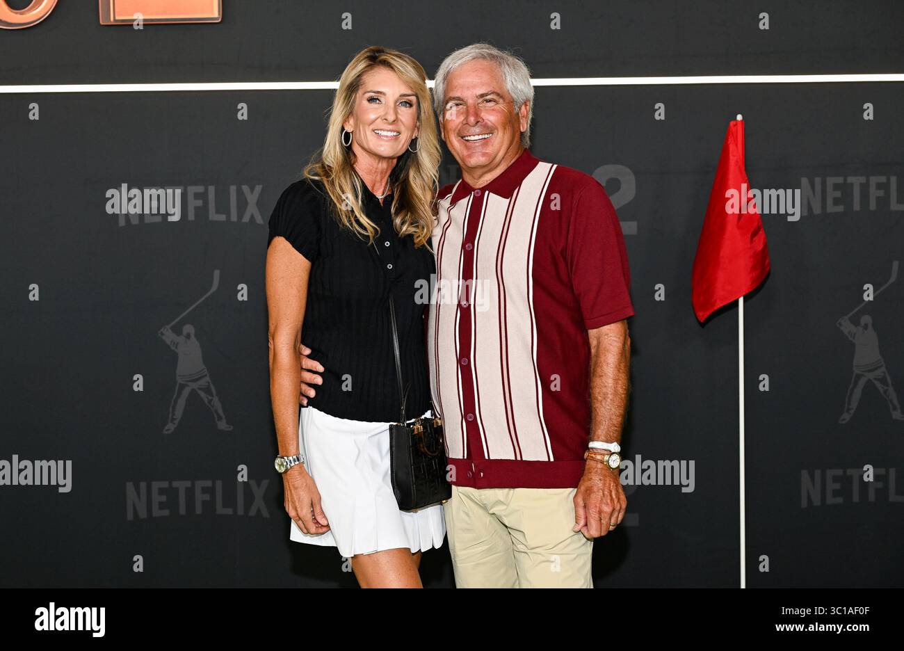 Fred Couples, right, and wife Suzanne Hannemann attend the premiere of ...
