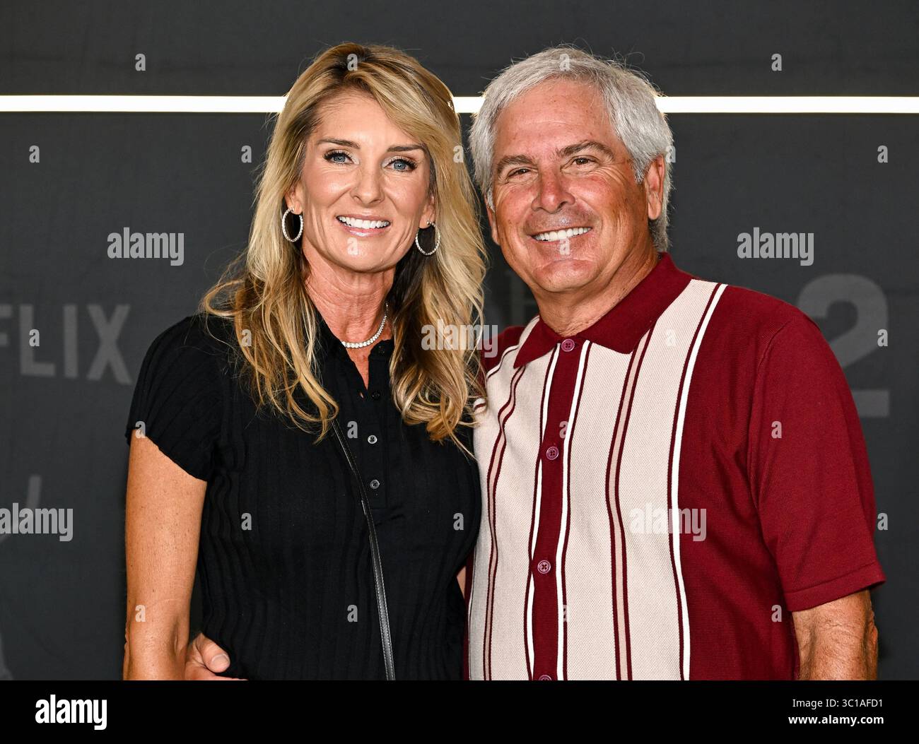 Fred Couples, right, and wife Suzanne Hannemann attend the premiere of ...