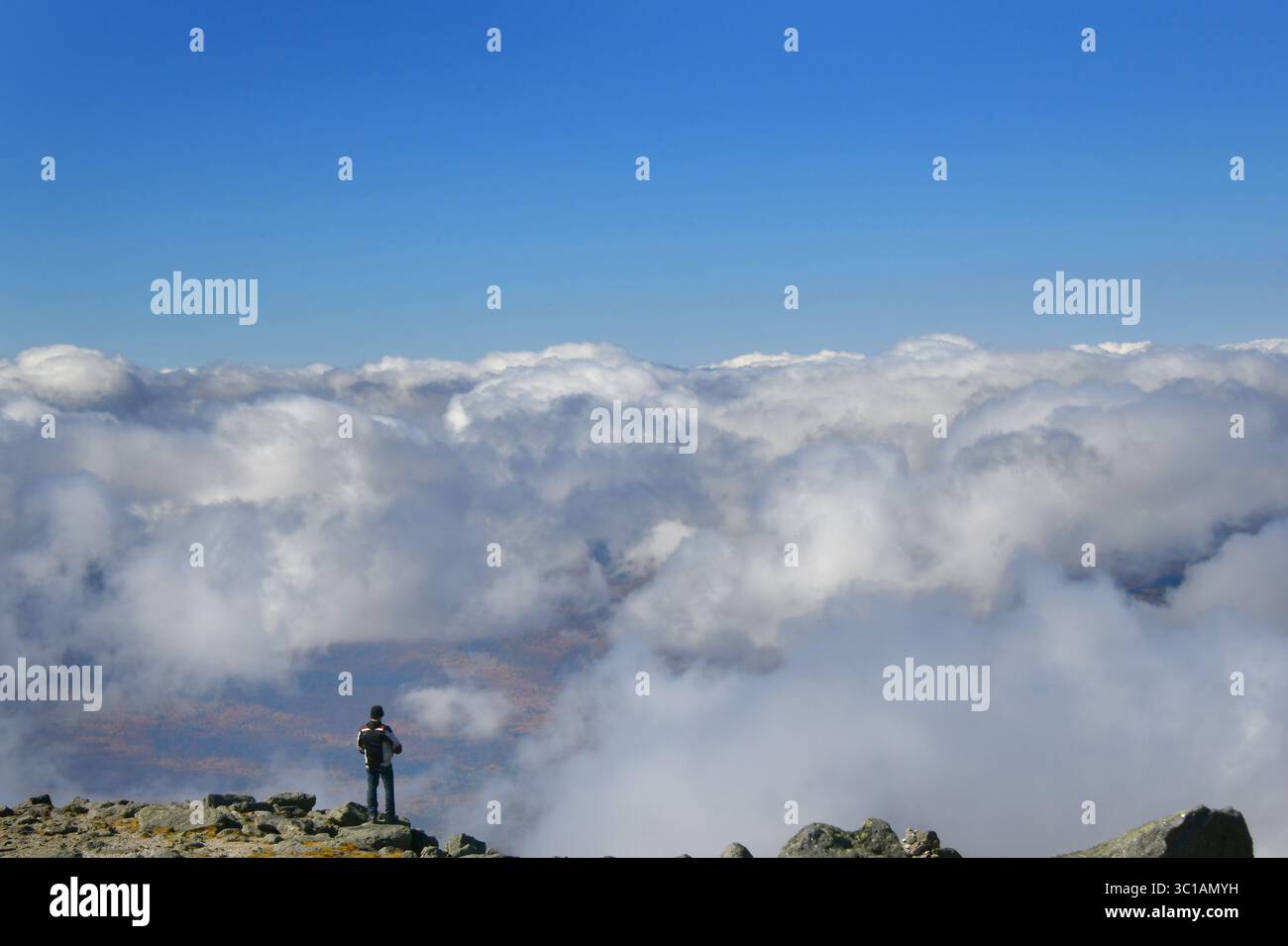 All alone at the edge of Mount Washington, in New Hampshire, a man ...