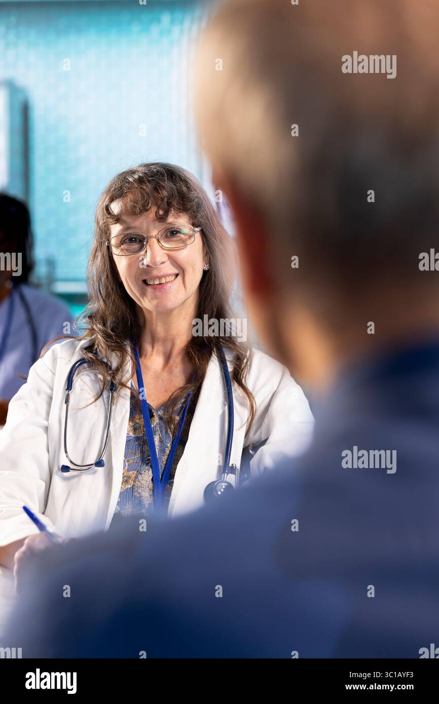 Aged medic meeting with old male patient to discuss medical test ...