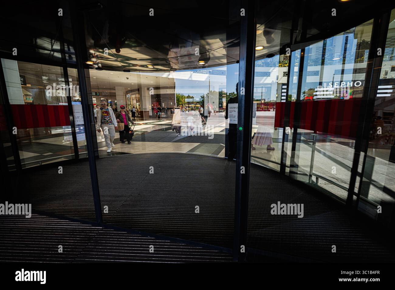 Warsaw, Poland - July 02, 2025: A dynamic view of a revolving door at ...