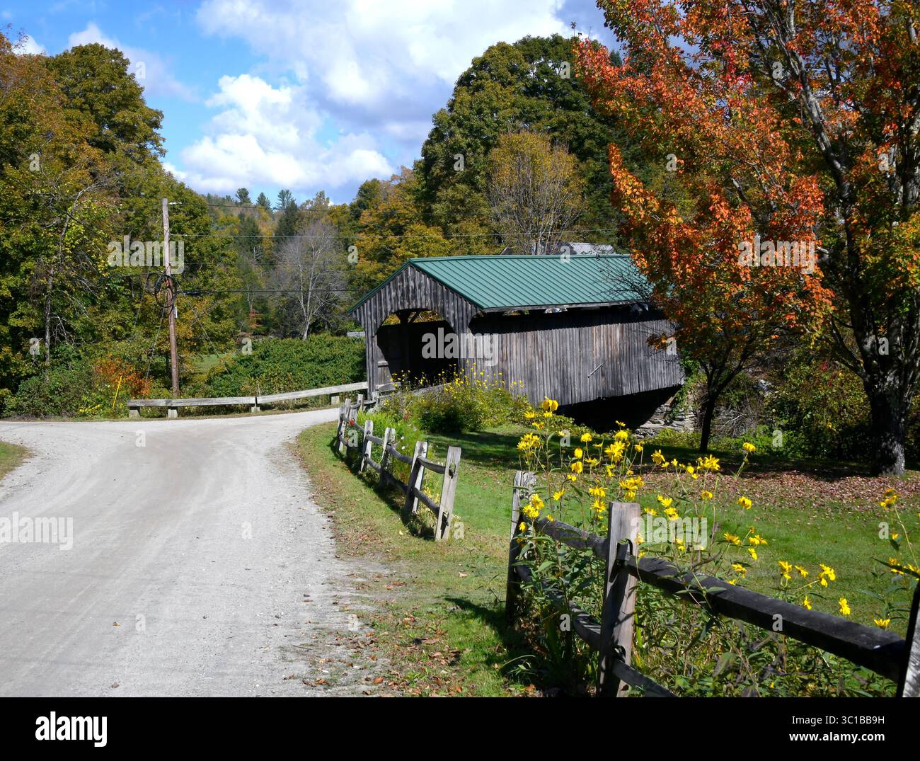 Historic Church Street Covered Bridge is green tin roofed and weathered ...