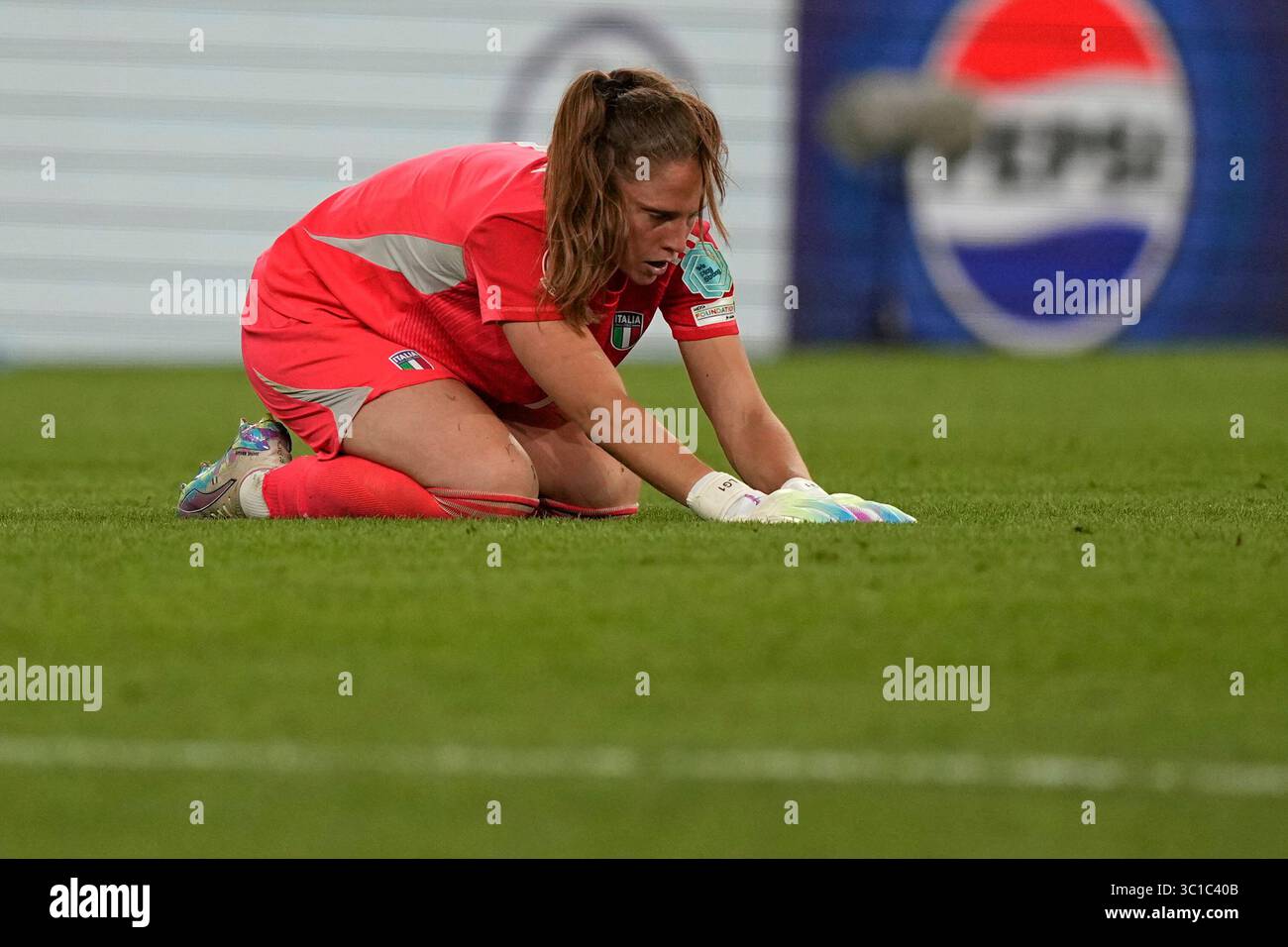 Italy's goalkeeper Laura Giuliani reacts after losing to England in the ...