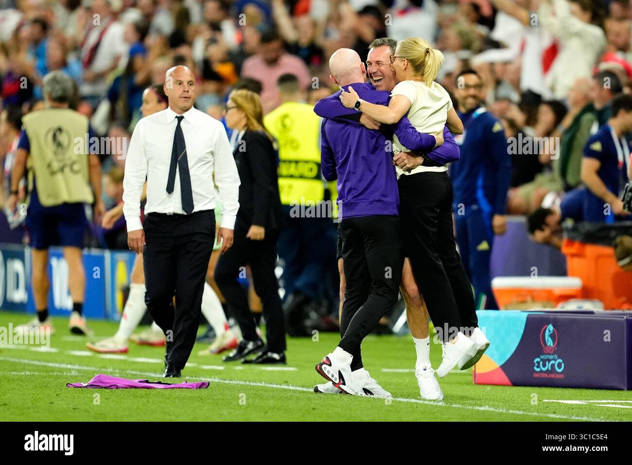 England head coach Sarina Wiegman (right) celebrates victory with ...