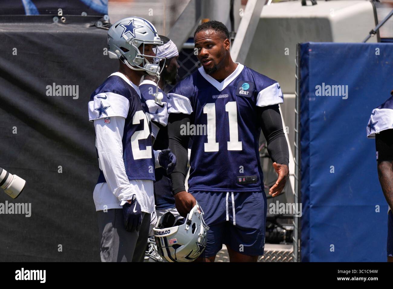 Dallas Cowboys cornerback C.J. Goodwin, left, talks with defensive end ...