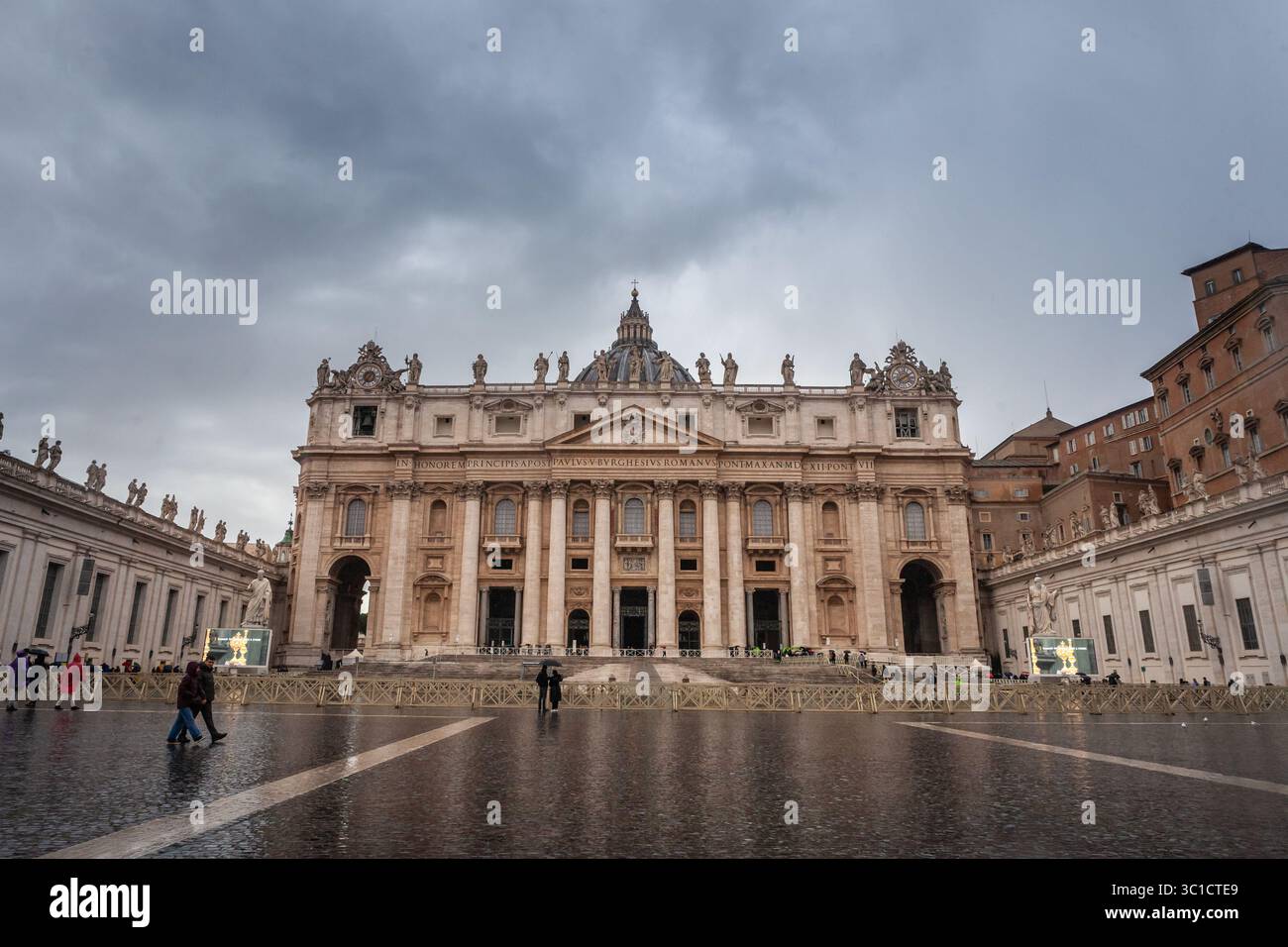VATICAN - JANUARY 15, 2025: St Peter Basilica towers over rain soaked ...
