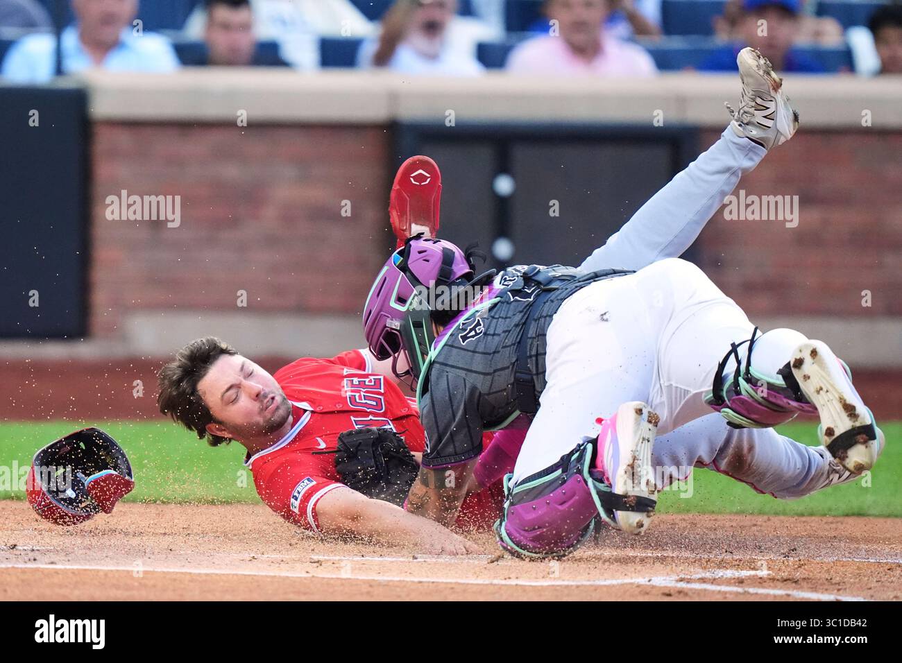 New York Mets catcher Francisco Alvarez, right, tags out Los Angeles ...