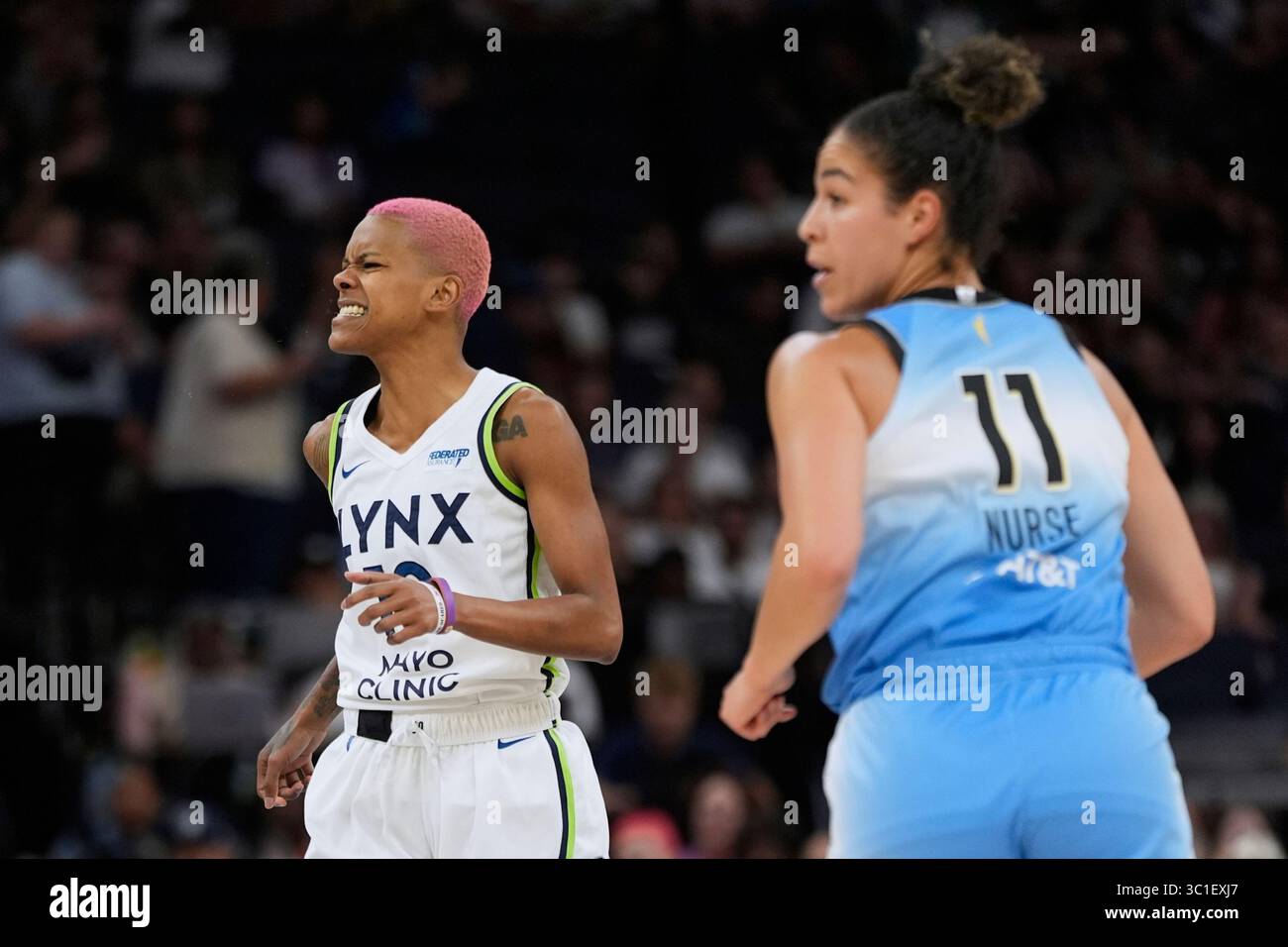 Minnesota Lynx guard Courtney Williams, left, reacts next to Chicago ...