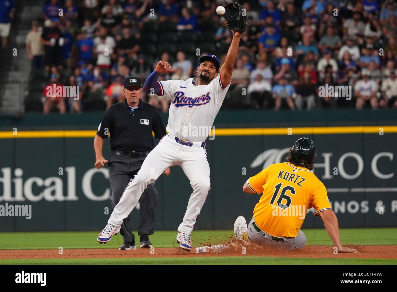 Athletics' Nick Kurtz (16) steals second base against Texas Rangers ...