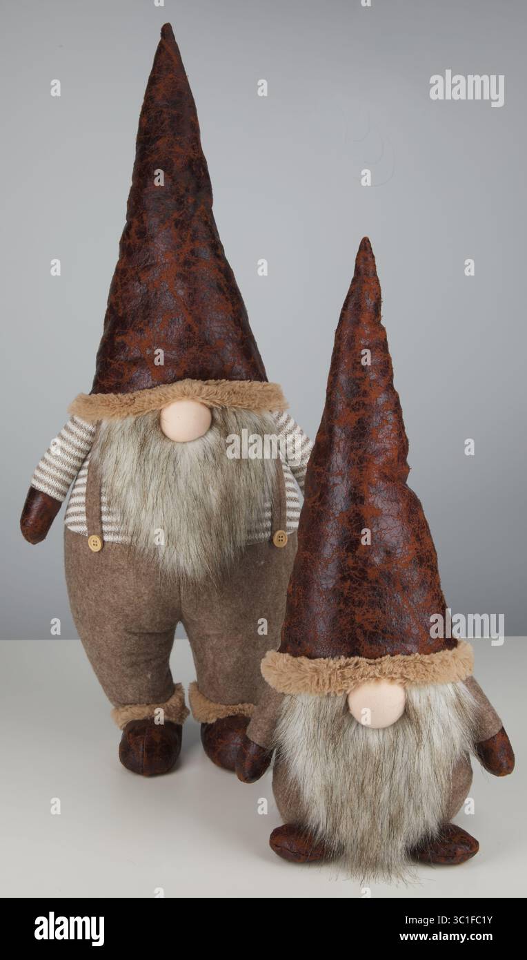 fat dwarf doll with a beard and a hat isolated nature background with ...