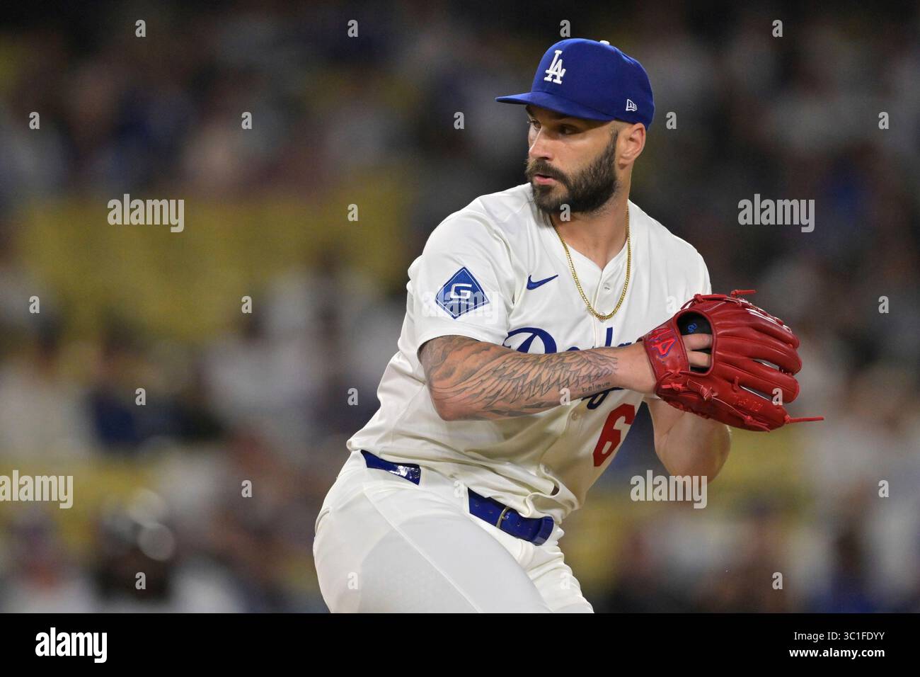 Los Angeles Dodgers relief pitcher Tanner Scott delivers to the plate ...