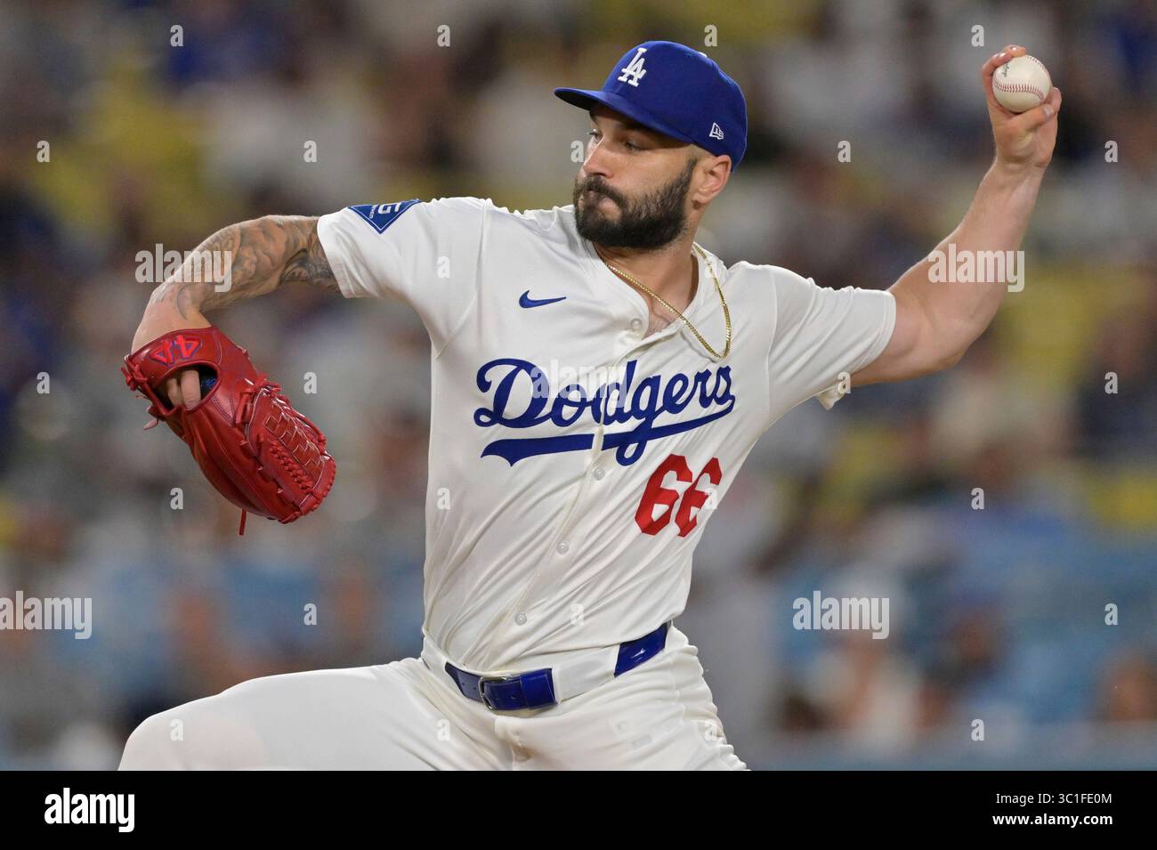 Los Angeles Dodgers relief pitcher Tanner Scott delivers to the plate ...
