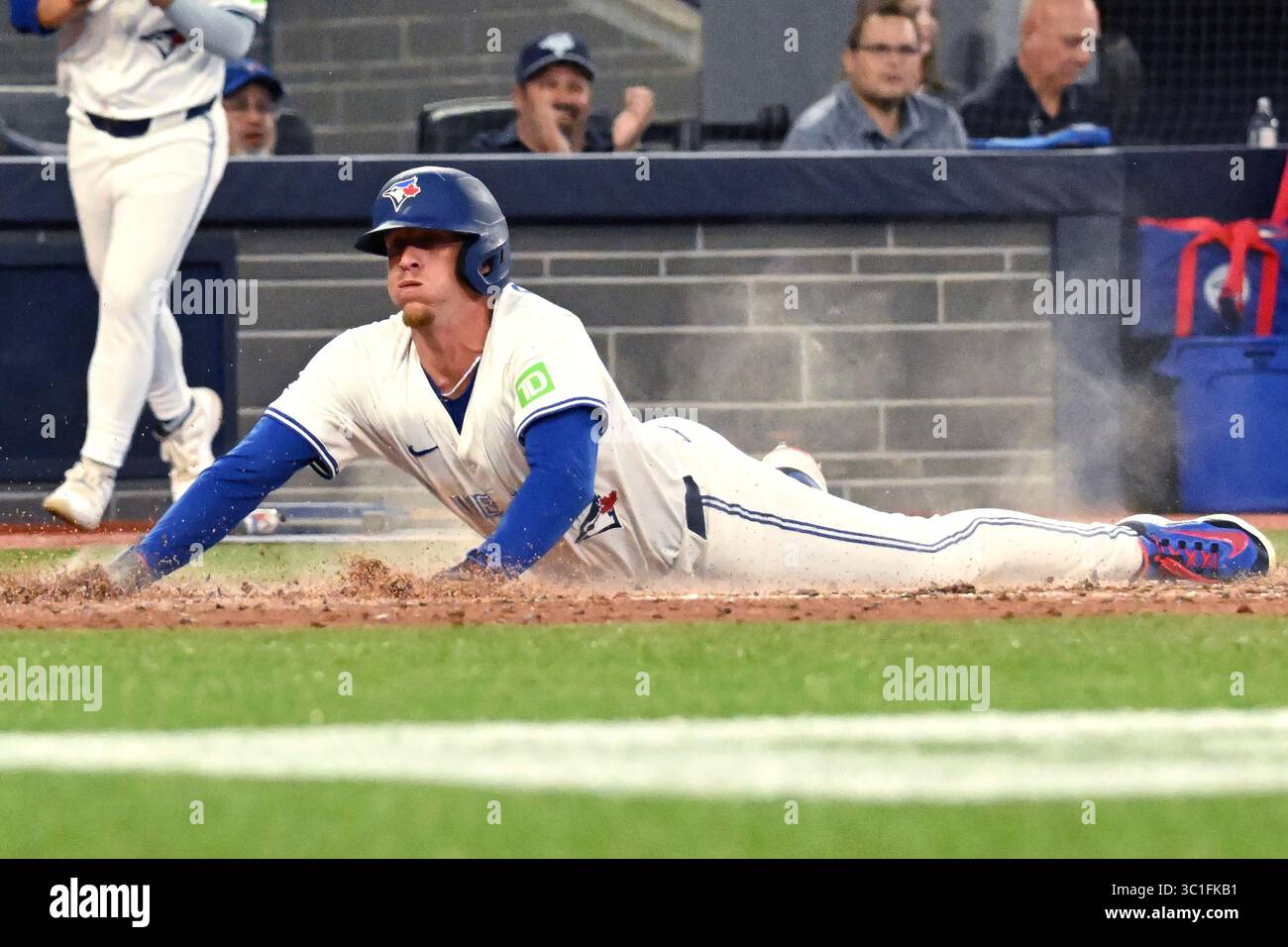 Toronto Blue Jays' Myles Straw (3) slides home to score on a double by ...