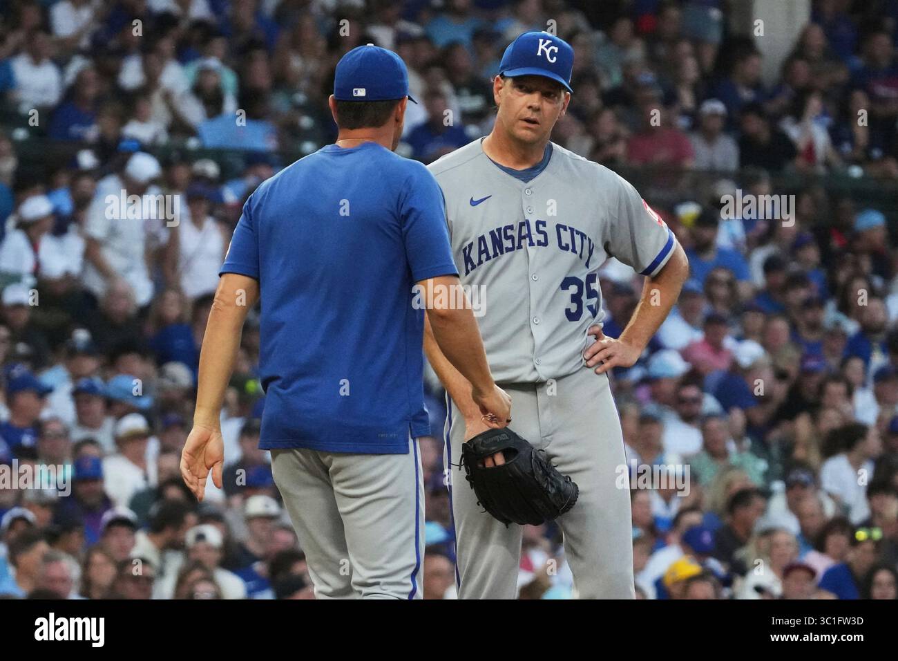 Kansas City Royals starting pitcher Rich Hill, right, talks with ...