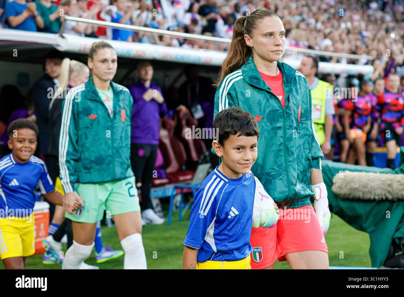 The Teams enter the field together with the refeering trio during the ...