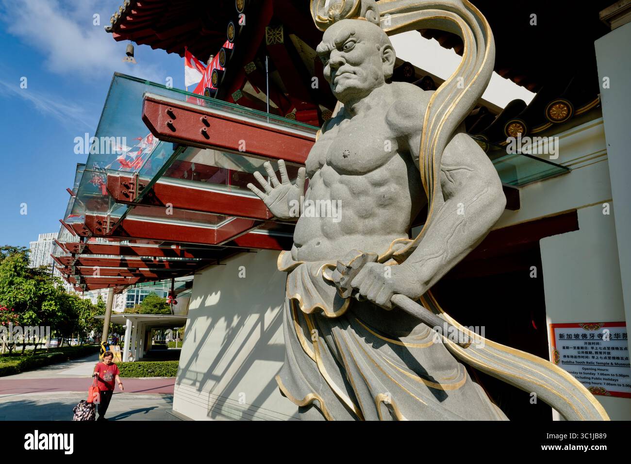 A fierce looking Chinese temple guardian statue at the entrance to the ...