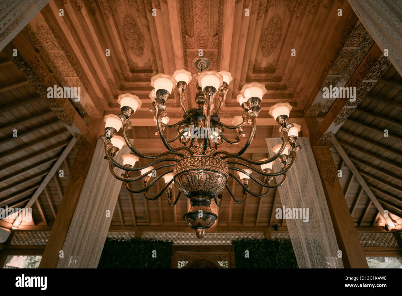 A magnificent traditional Javanese style chandelier hanging from an ...