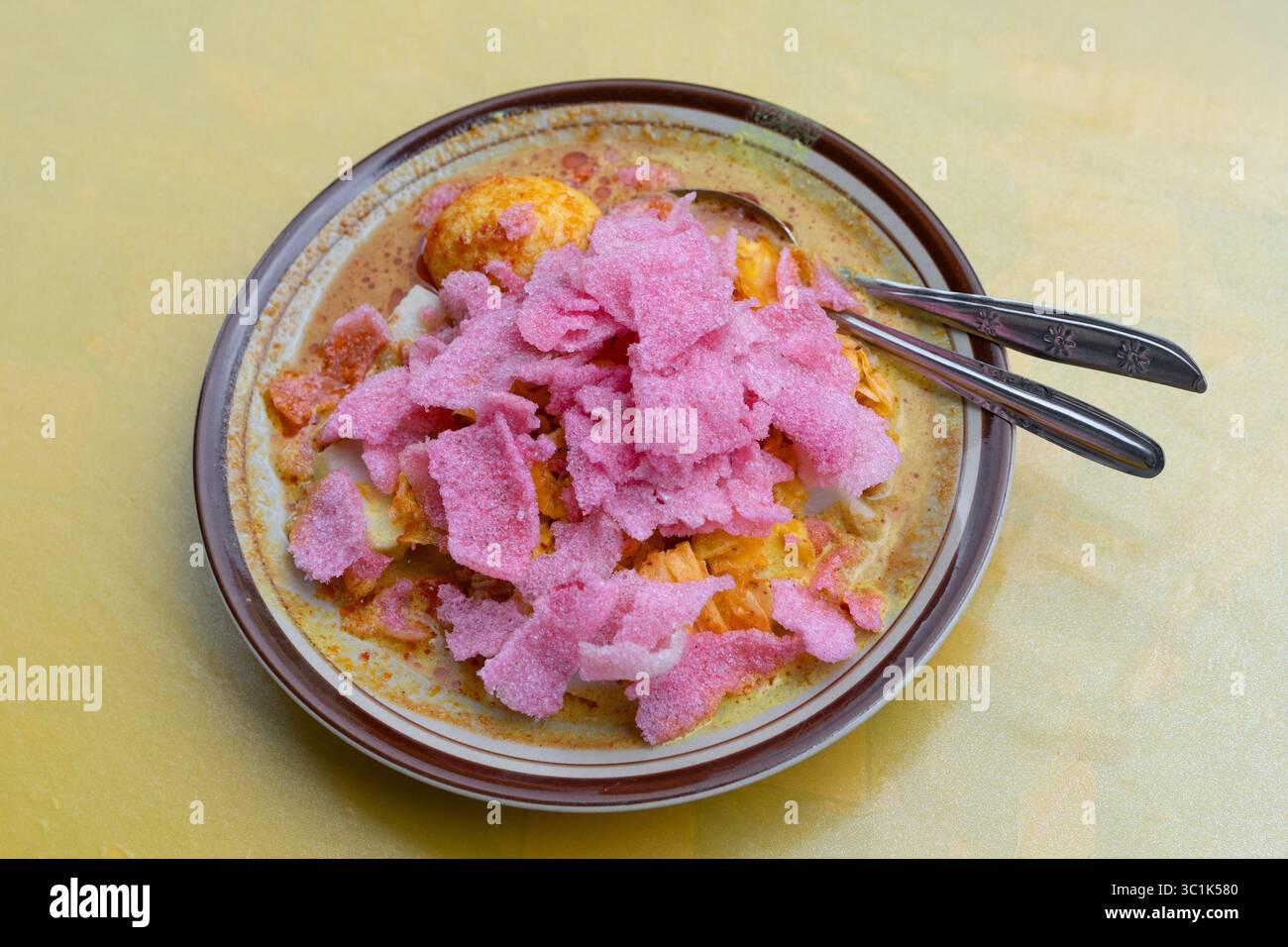 Lontong Sayur, an Indonesian breakfast of rice cake and egg in coconut ...