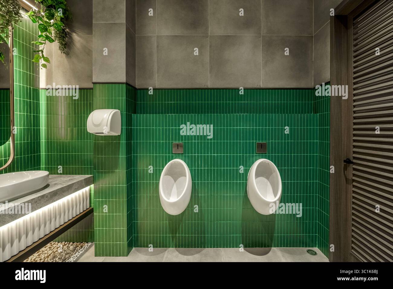 Luxury public washroom with backlit mirrors over a double vanity ...