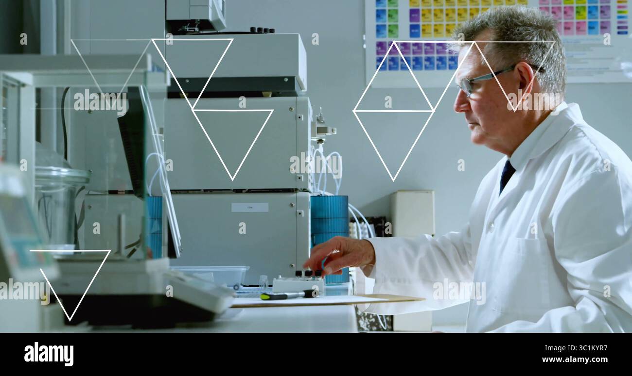 Senior male scientist handling pipette hi-res stock photography and ...