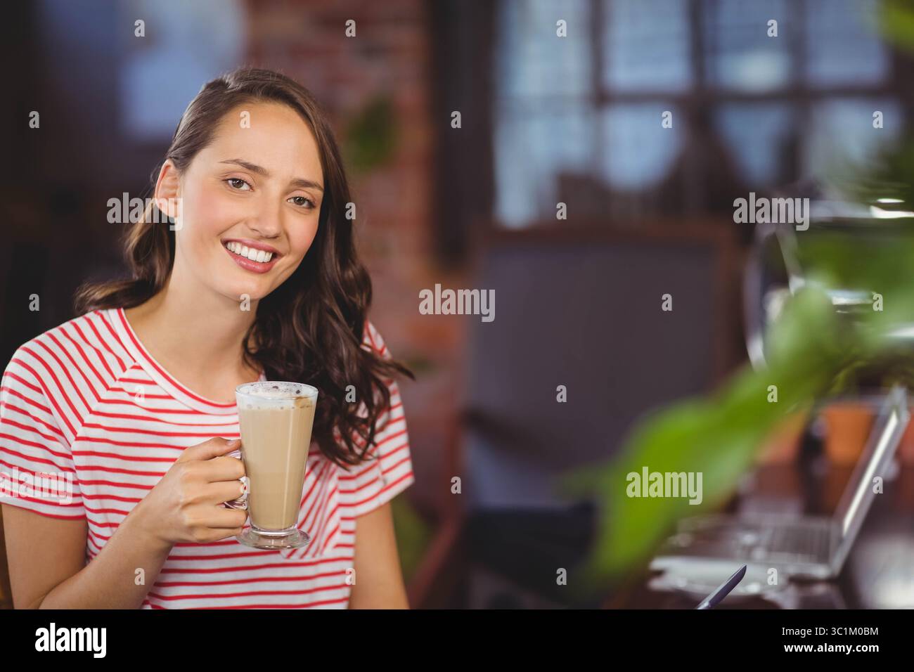 Laptop resting on tall hi-res stock photography and images - Alamy