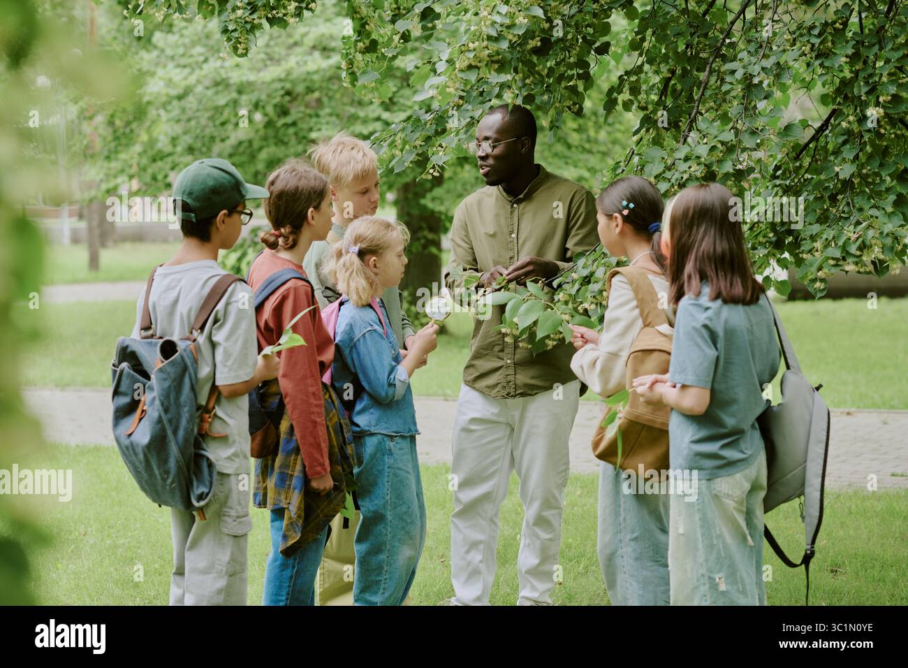 Multiethnic school children observing hi-res stock photography and ...