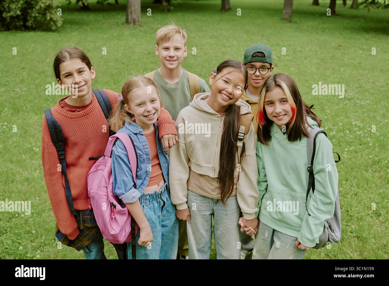Group of Diverse Children Standing Outdoors Smiling in Park Stock Photo ...