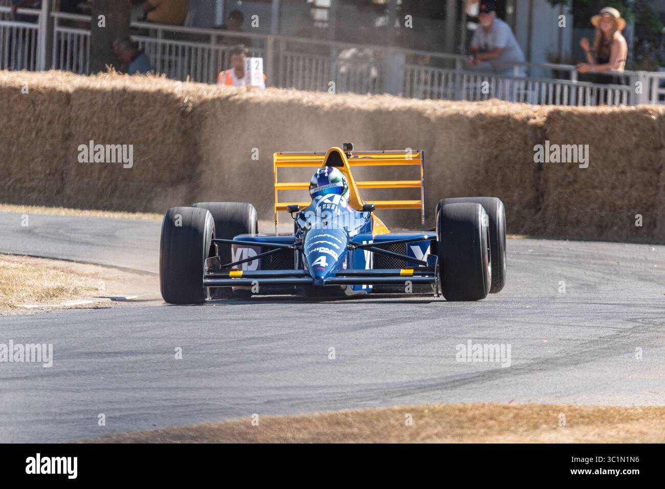 Tyrrell 018 classic Formula 1 racing car driving up the hillclimb at ...