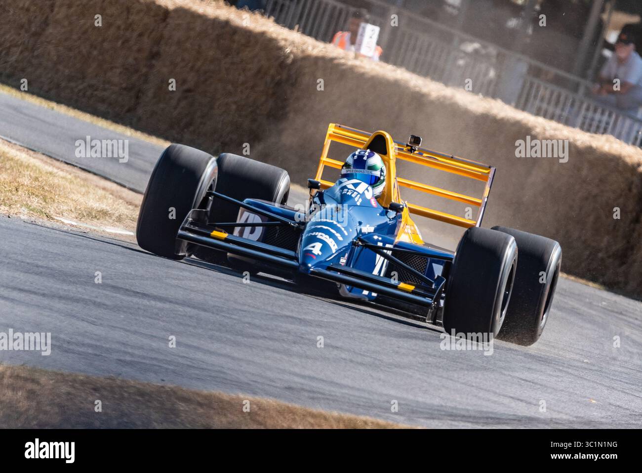 Tyrrell 018 classic Formula 1 racing car driving up the hillclimb at ...