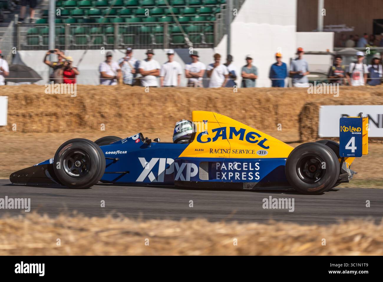 Tyrrell 018 classic Formula 1 racing car driving up the hillclimb at ...