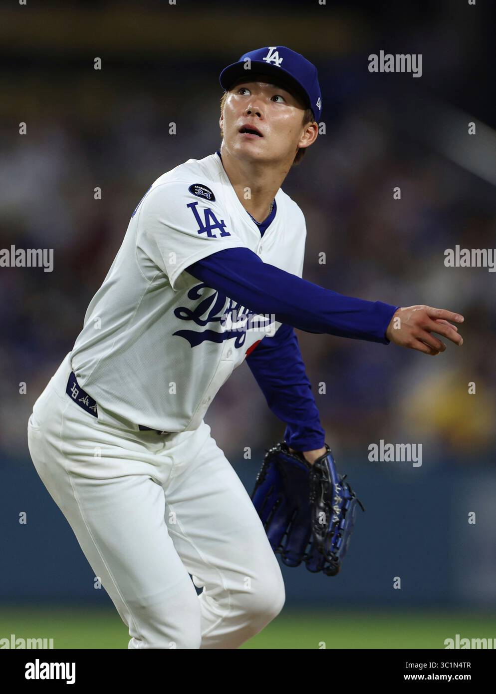 Los Angeles Dodgers' starting pitcher Yoshinobu Yamamoto reacts as he ...