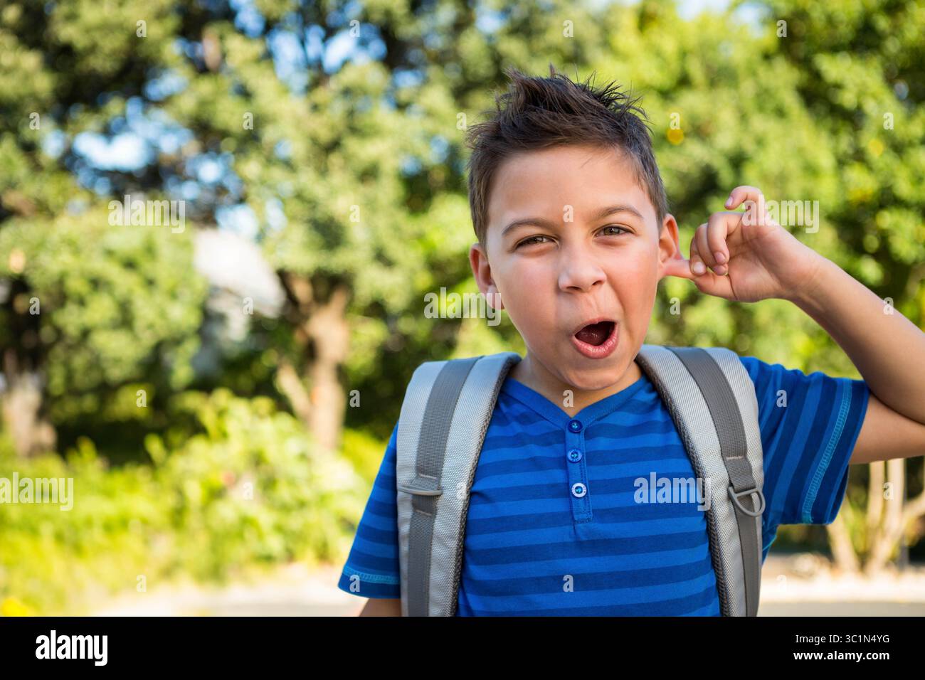 Boy pulling ear hi-res stock photography and images - Alamy