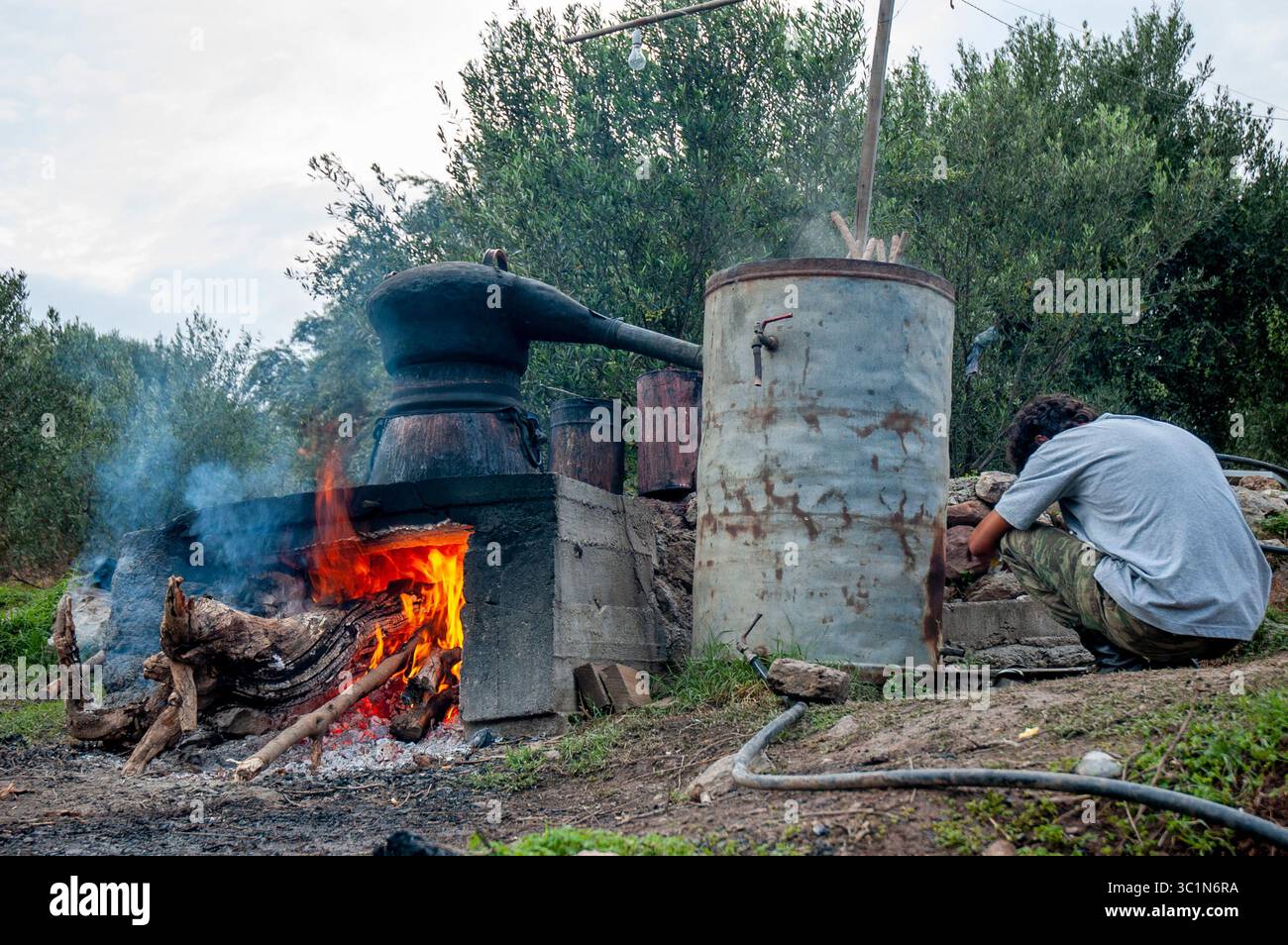 Traditional way of distilling raki in Crete Stock Photo - Alamy