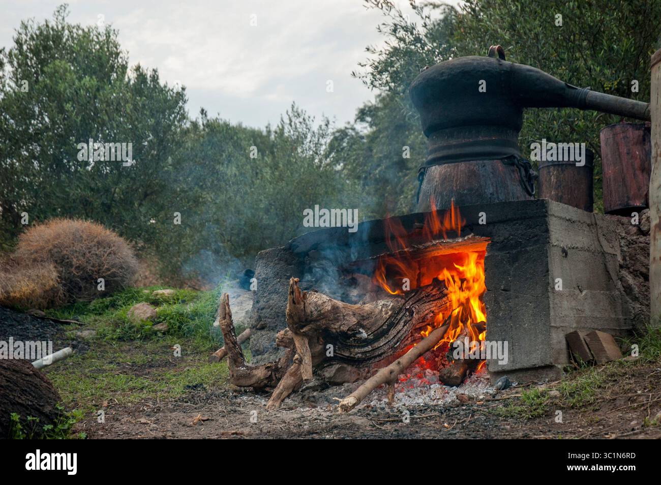 Traditional way of distilling raki in Crete Stock Photo - Alamy