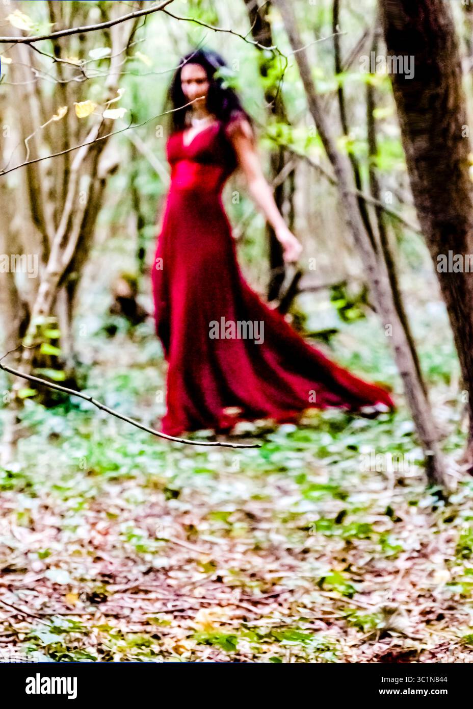 Woman in red walks through hi-res stock photography and images - Alamy