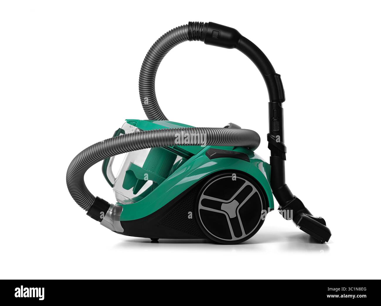A modern green vacuum cleaner with a transparent dust container and ...